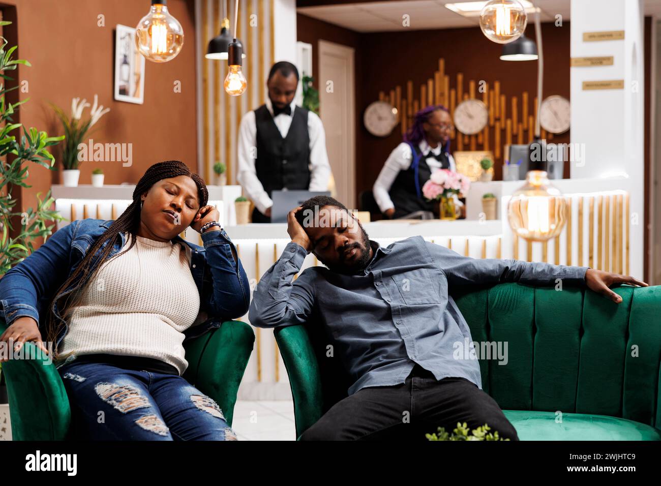 Jet lag. Tired exhausted African American tourists sleeping in hotel ...