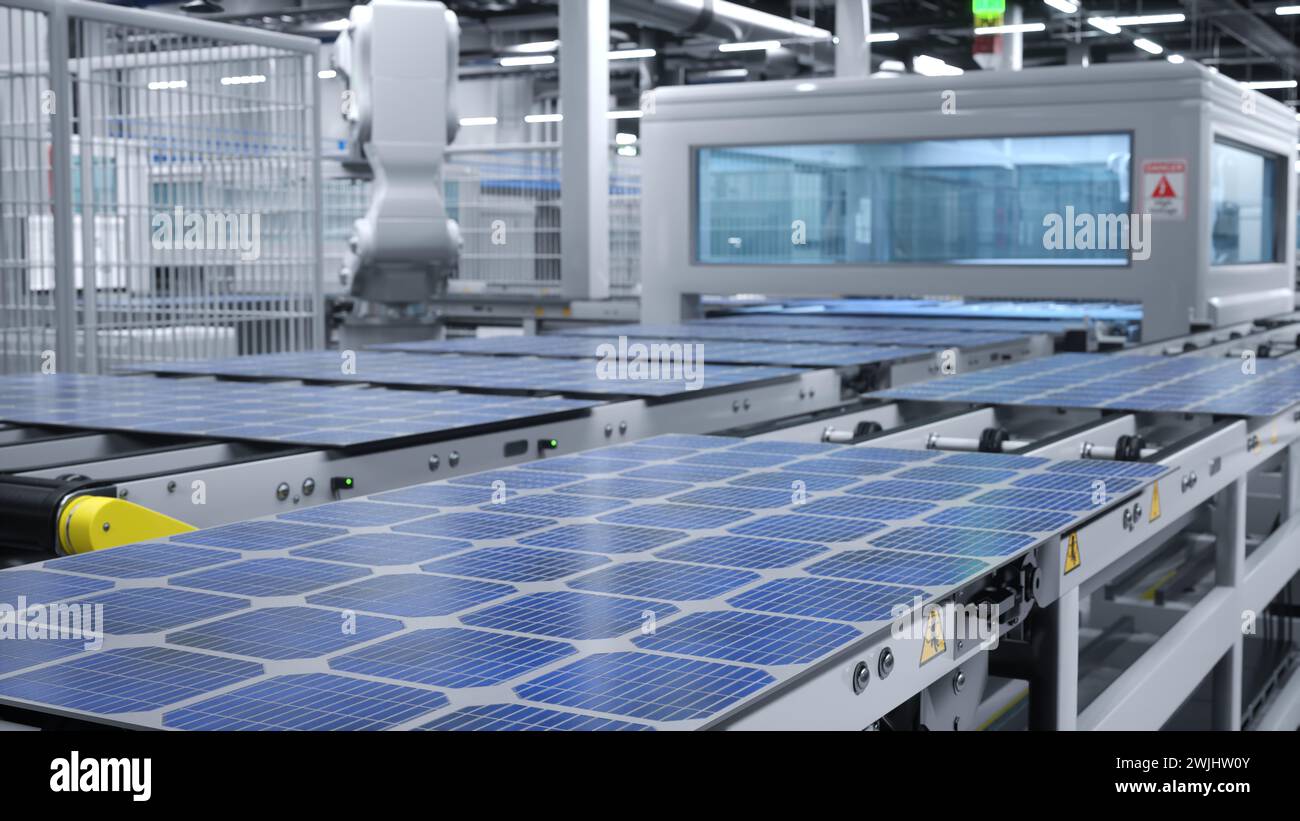 Solar panel factory with industrial robot arms placing PV modules on ...
