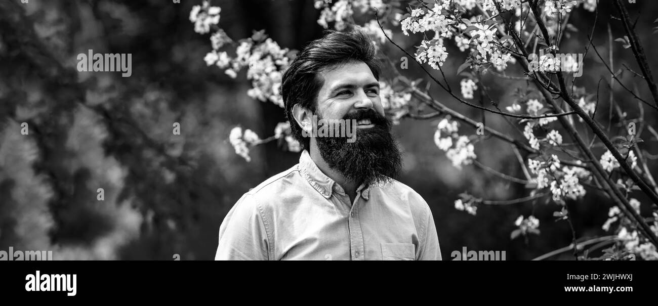 Spring banner of man outdoor. Guy gardening in the backyard garden ...