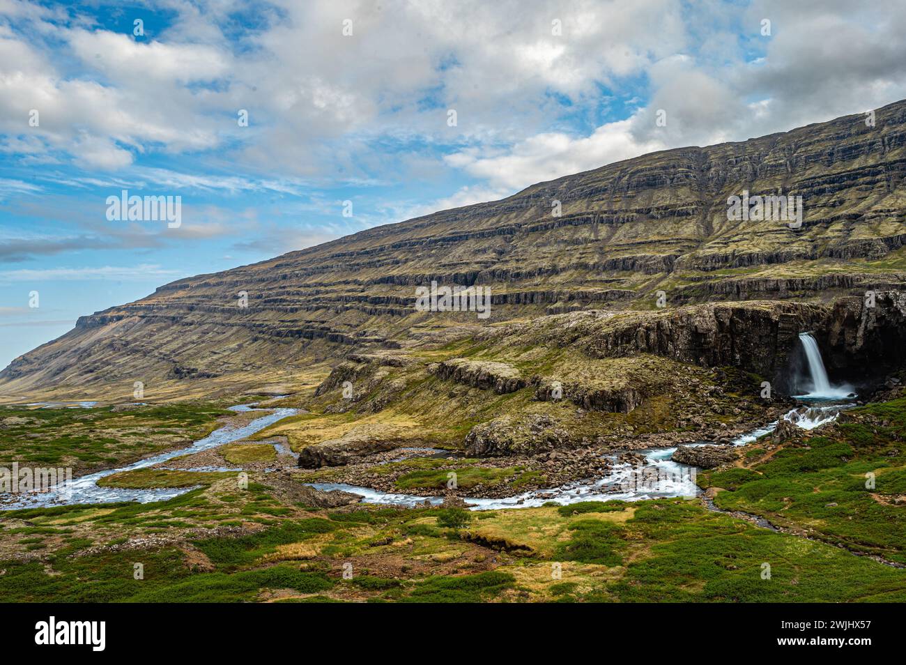 Folaldafoss Waterfall tumbles gracefully in Oxi Mountain Pass, a hidden ...