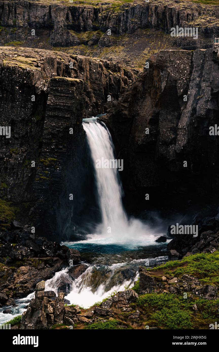 Folaldafoss Waterfall tumbles gracefully in Oxi Mountain Pass, a hidden ...