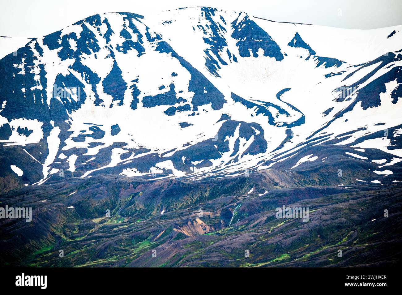 Iceland's peaks draped in snow, revealing the stark contrasts and vivid ...