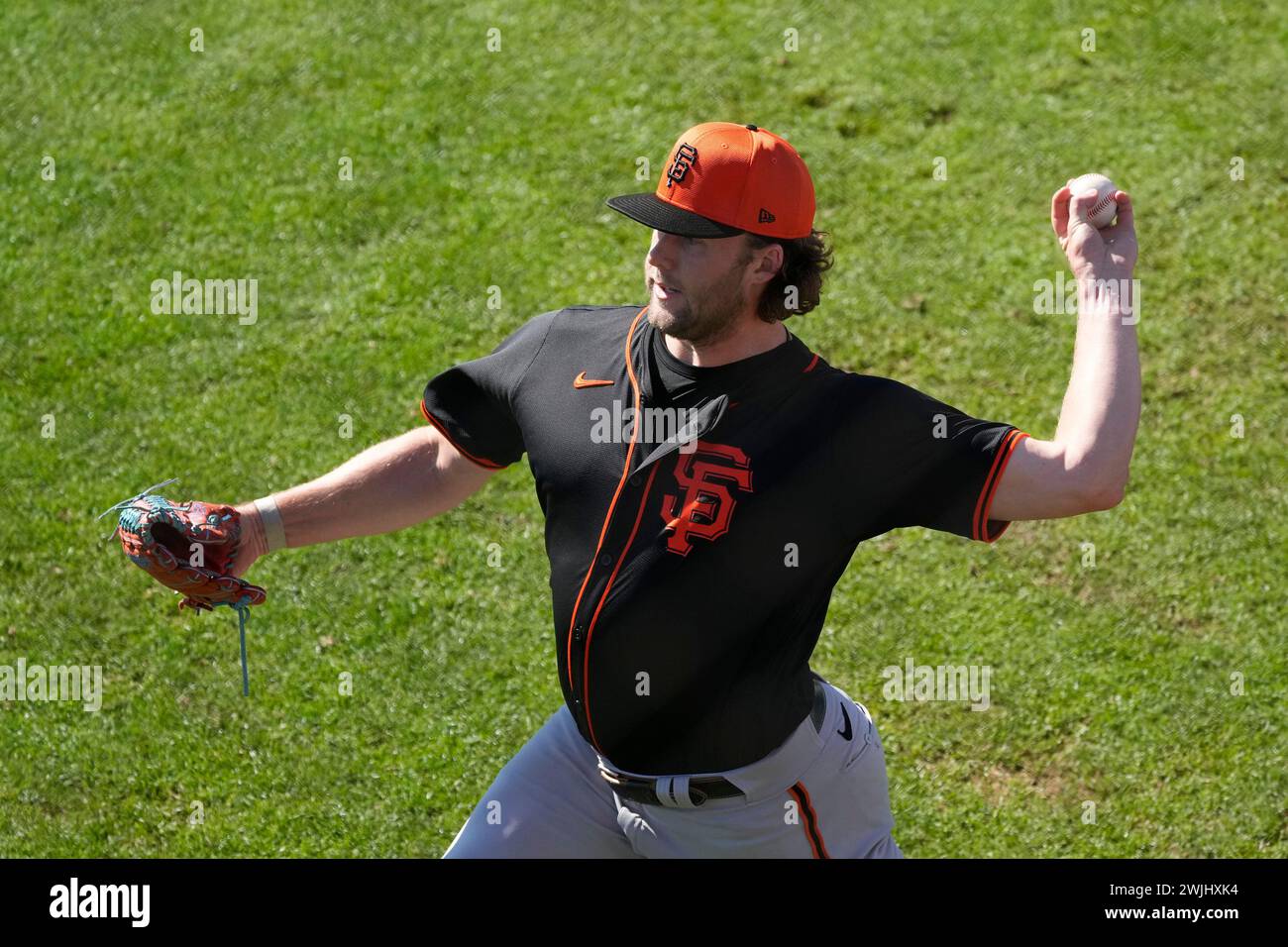 San Francisco Giants relief pitcher Erik Miller warms up during spring training baseball ...