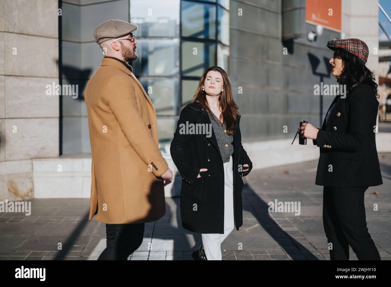 Outdoor business conversation: Young entrepreneurs engaging in a lively ...