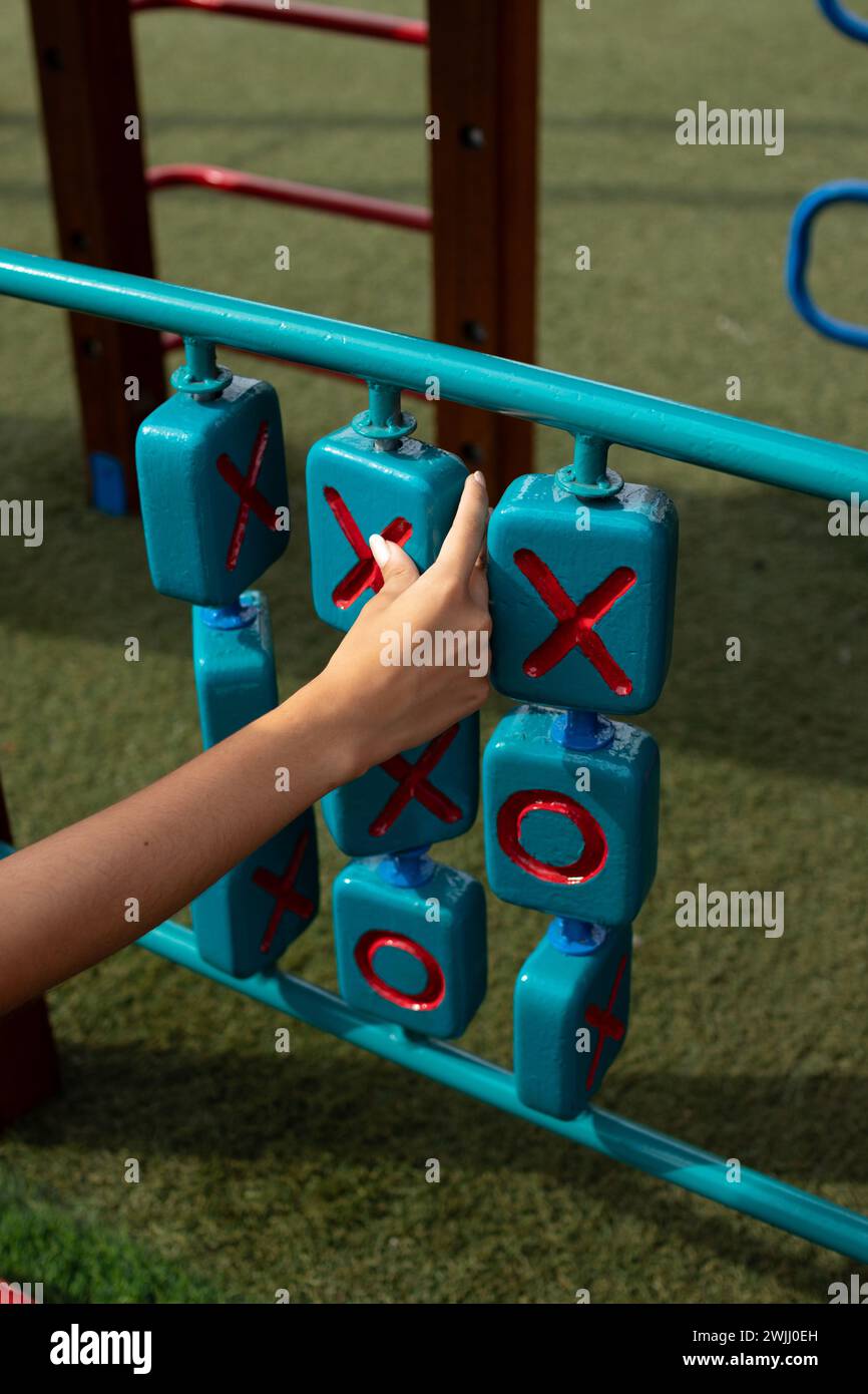 Girl playing tic tac toe in a playground Stock Photo - Alamy