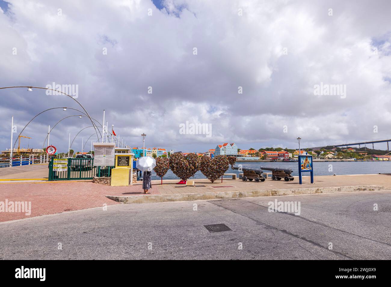 View of landmarks along st. Anna Bay waterfront with Queen Emma Bridge ...