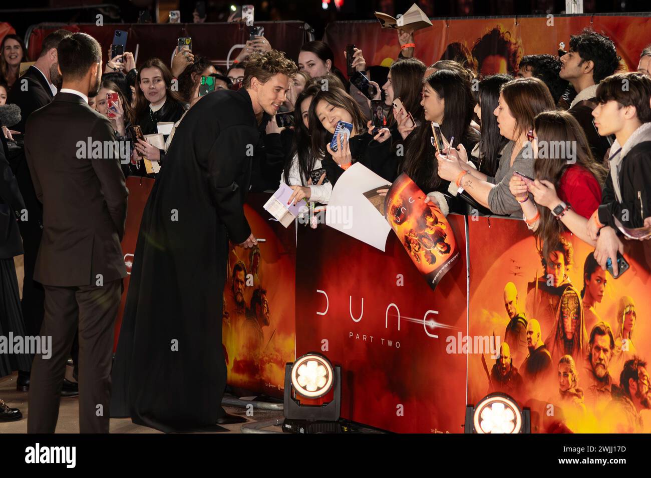 Austin Butler poses for photographs with fans upon arrival at the World ...