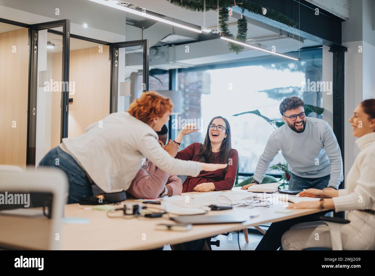 Business colleagues celebrating a successful project with happy smiles ...
