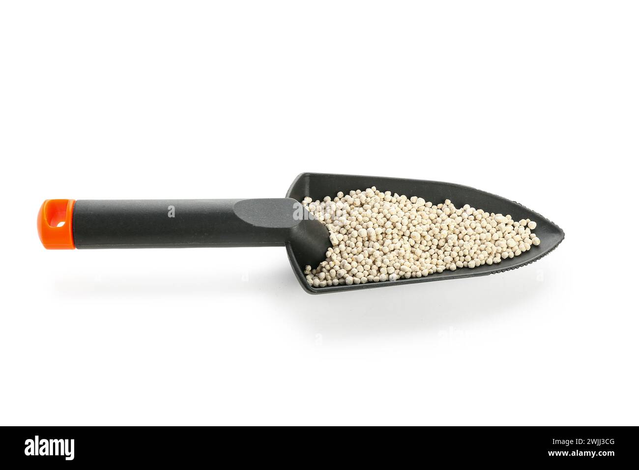 Gardening shovel with granular fertilizer isolated on white background ...