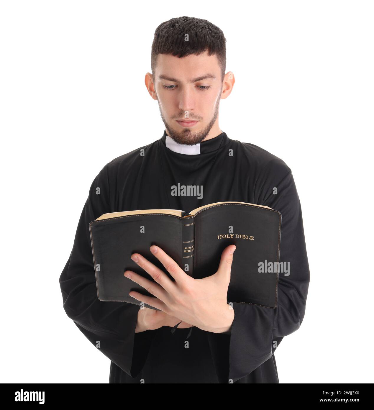 Young priest reading bible hi-res stock photography and images - Alamy
