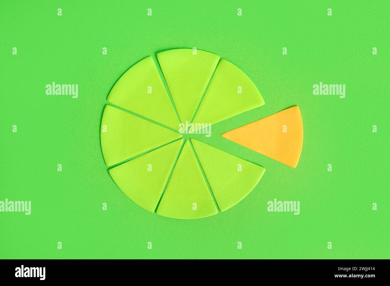 Composition with segments of paper circle on green background. Concept ...