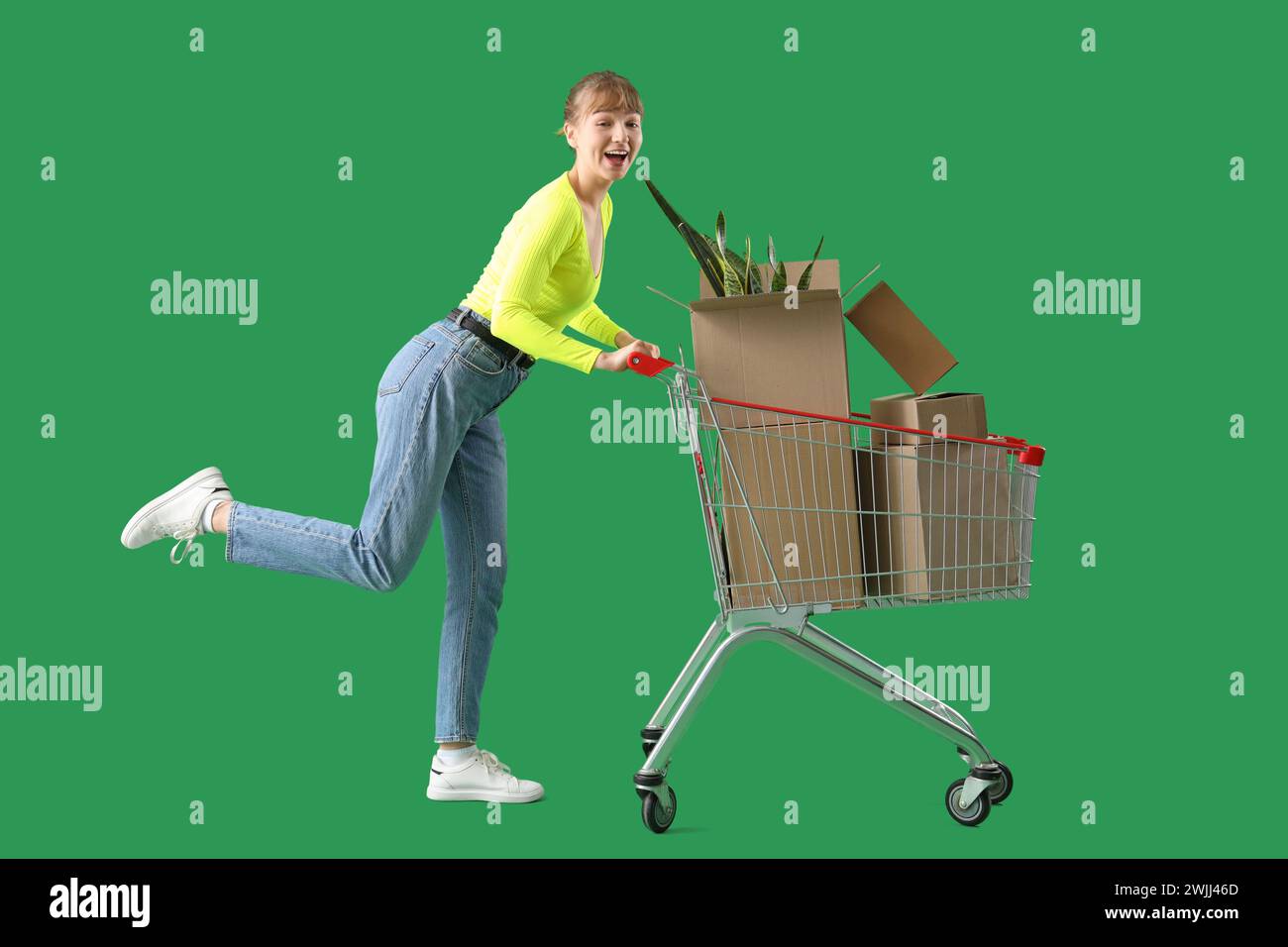 Running woman with shopping cart full of cardboard boxes on green ...