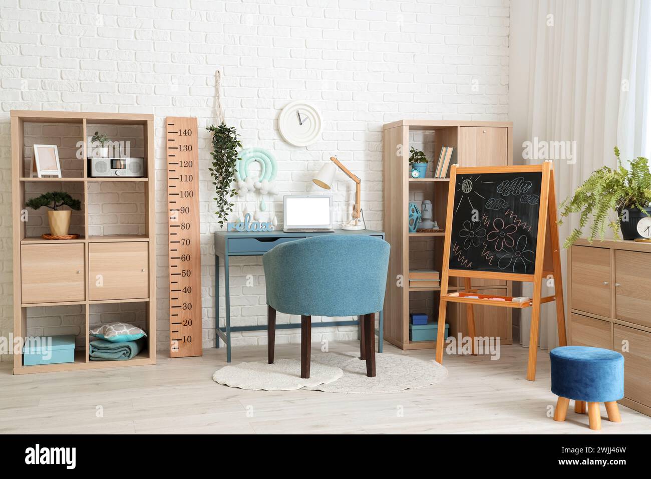 Modern children's room interior with comfortable workspace, laptop and ...