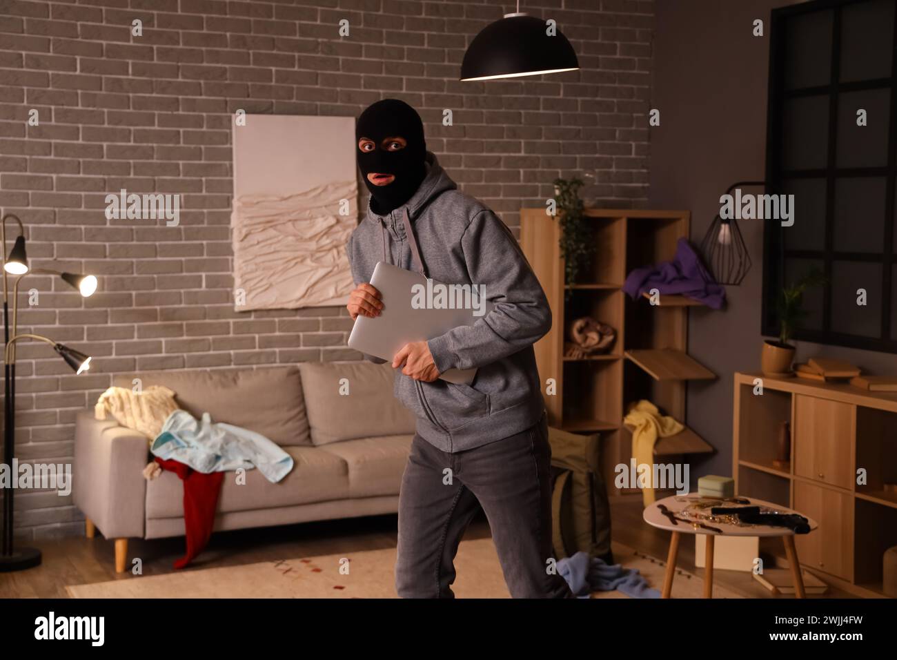 Thief stealing laptop hi-res stock photography and images - Alamy