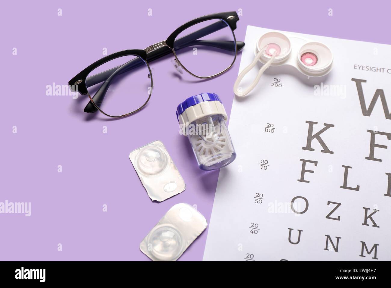 Eyeglasses with eye test chart and container for contact lenses on ...