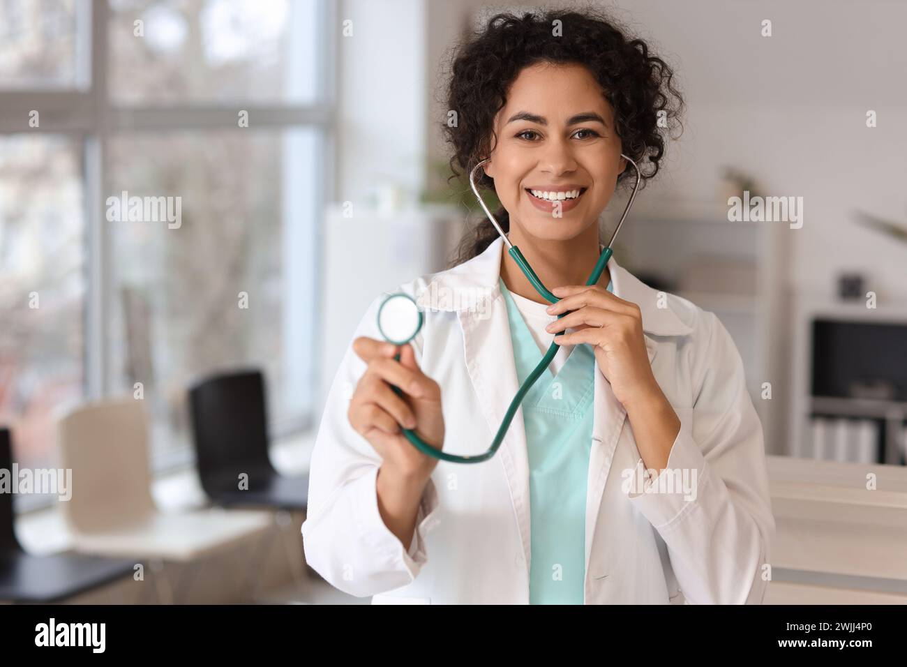 Female African-American medical intern with stethoscope in clinic Stock ...