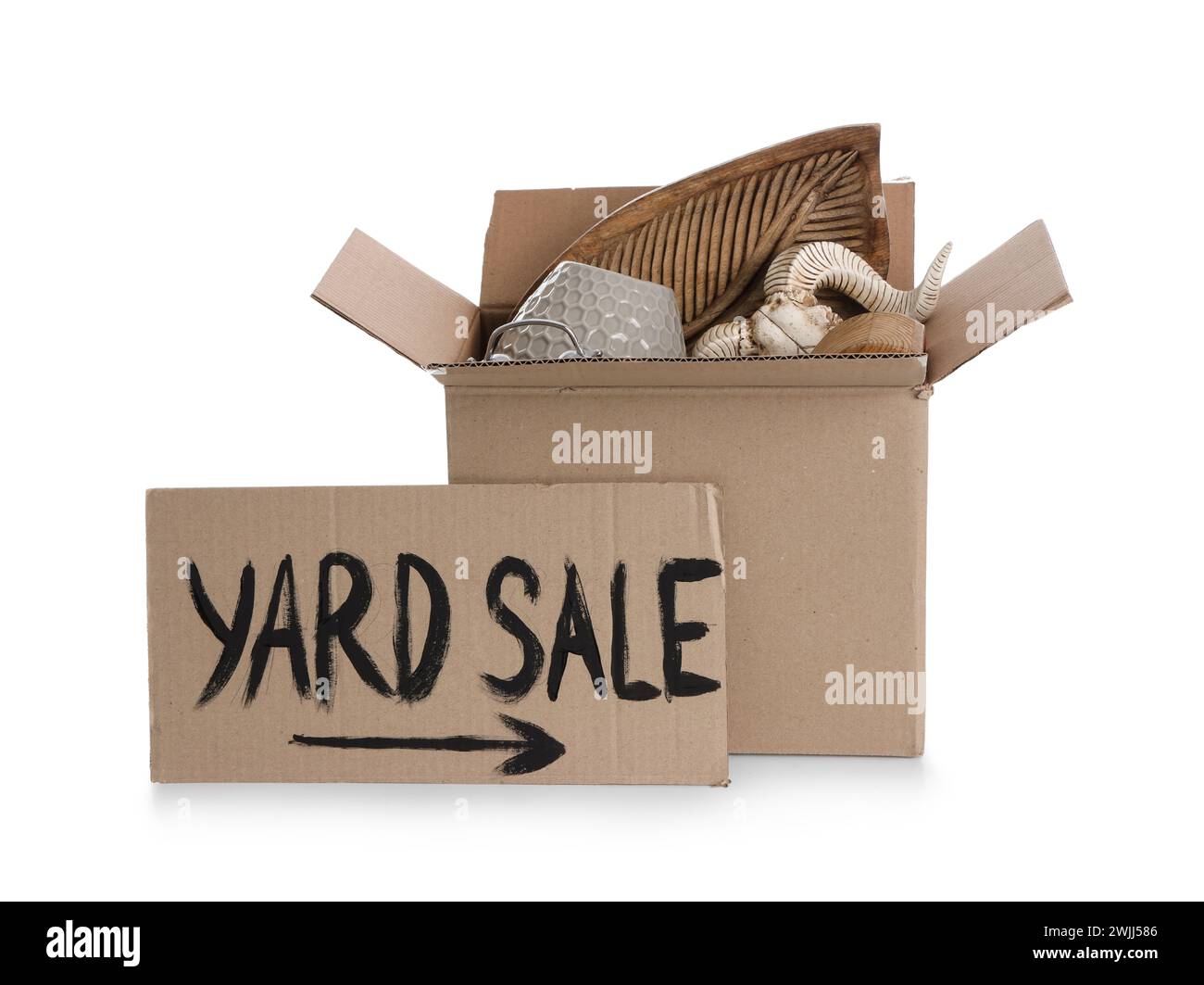 Box of unwanted stuff and cardboard with text YARD SALE on white ...