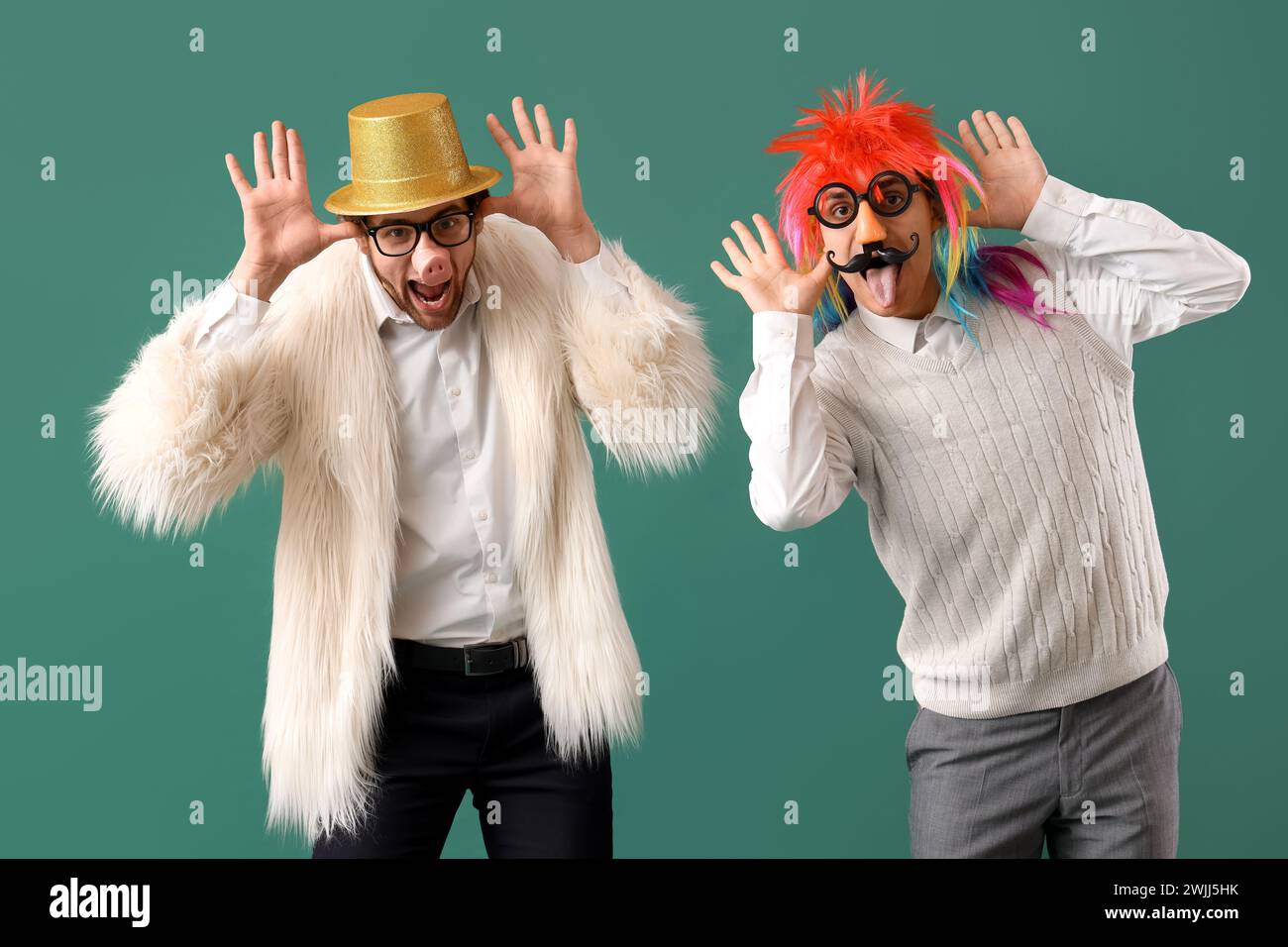 Business men in funny disguise grimacing on green background. April ...
