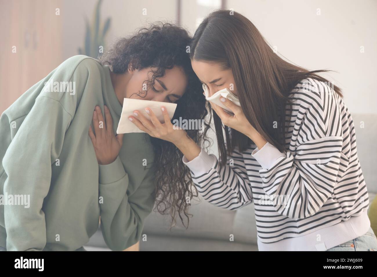 Young women choking on smoke in burning building Stock Photo - Alamy