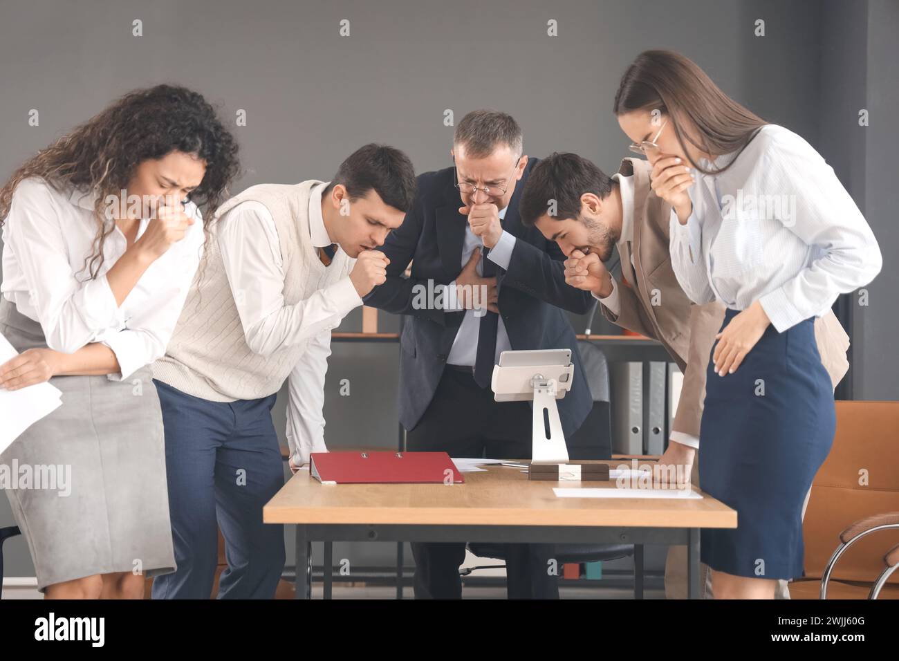 Business people choking on smoke in burning office building Stock Photo ...