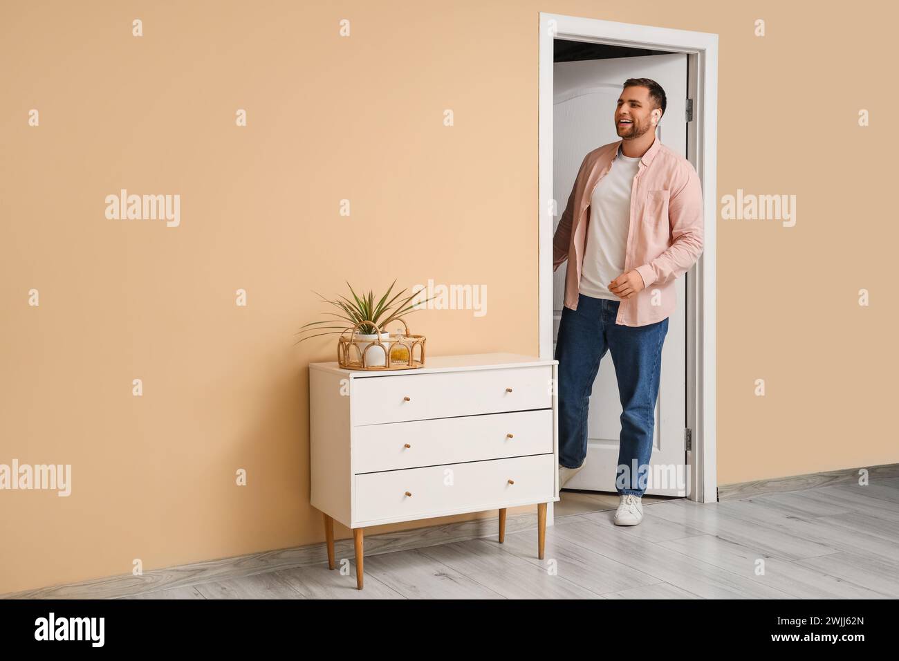 Man walking through room hi-res stock photography and images - Alamy