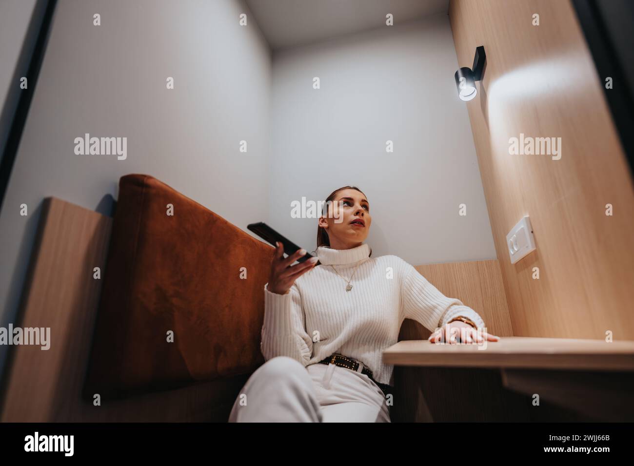 Lovely, female employee resting from work, having video call meeting in ...