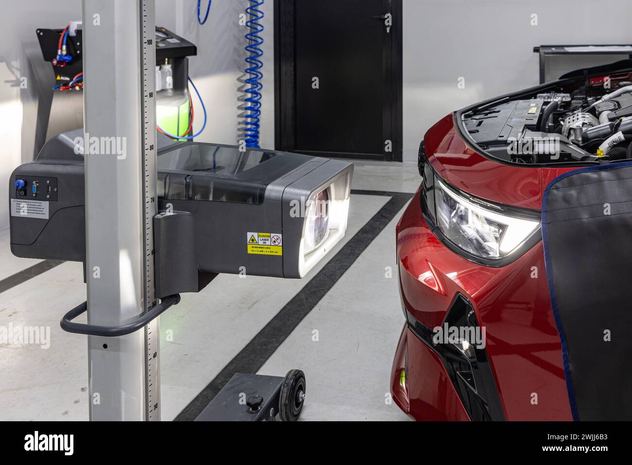 Headlight adjustment of the car in the car service. car repair shop ...