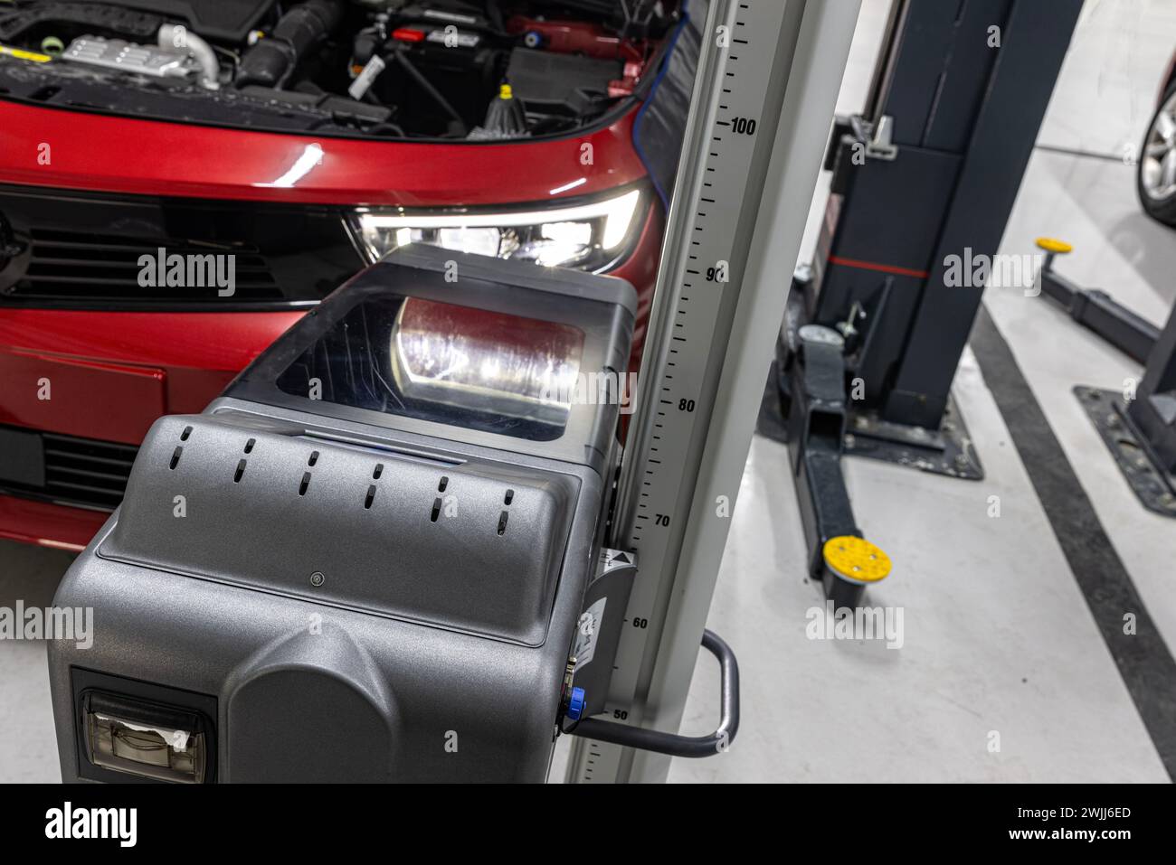 Headlight adjustment of the car in the car service. car repair shop ...