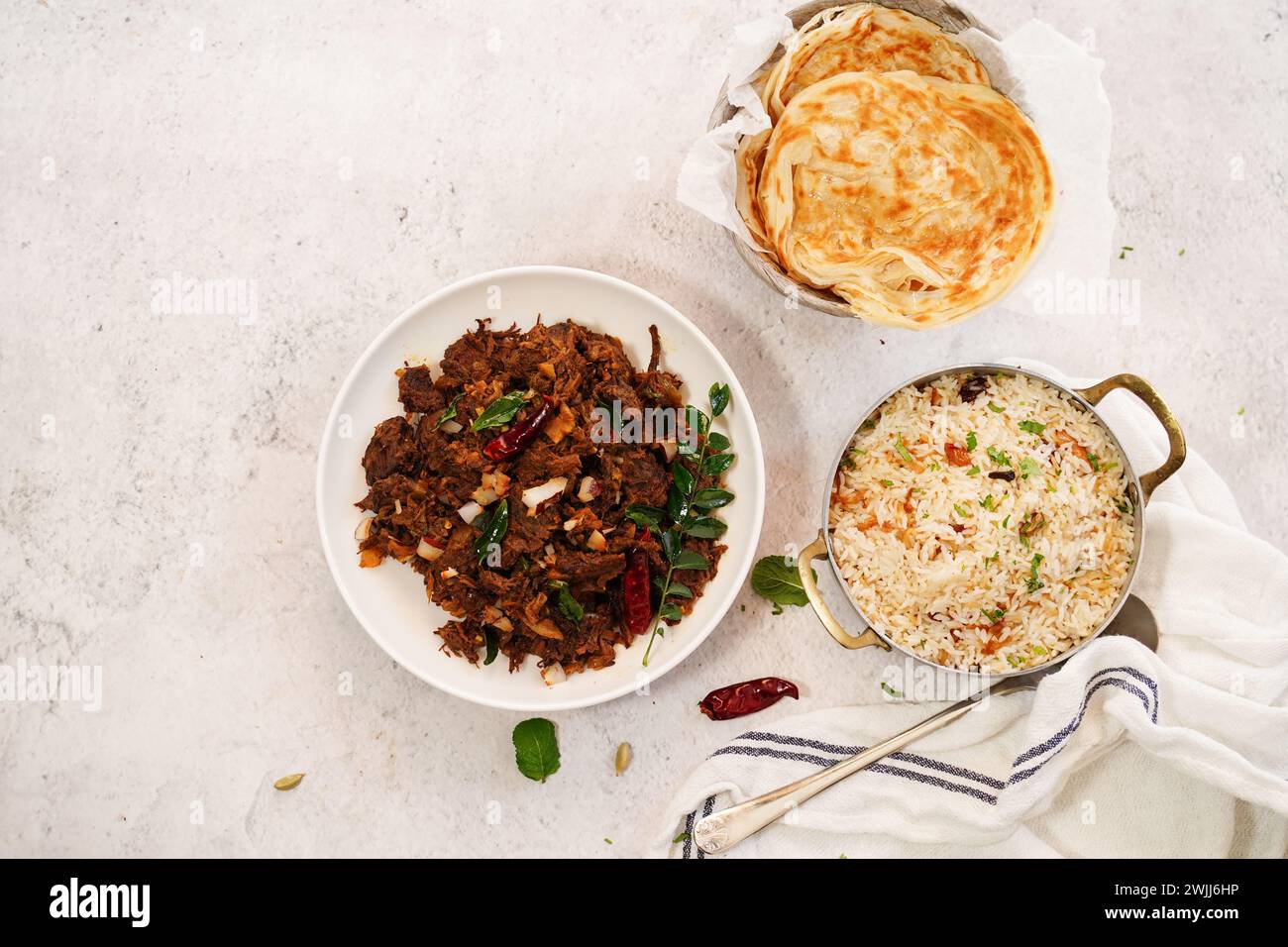 Kerala beef fry roast served with parotta and ghee rice - Malabar Iftar ...