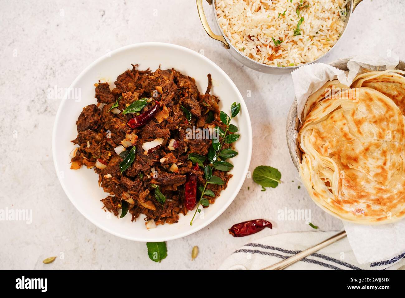 Kerala beef fry roast served with parotta and ghee rice - Malabar Iftar ...