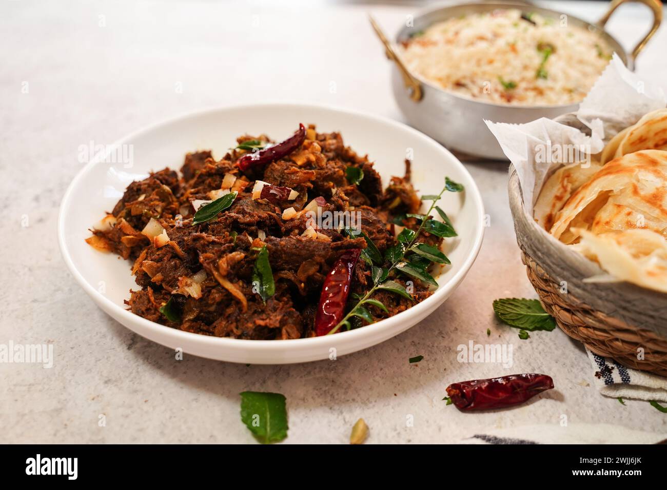 Kerala beef fry roast served with parotta and ghee rice - Malabar Iftar ...
