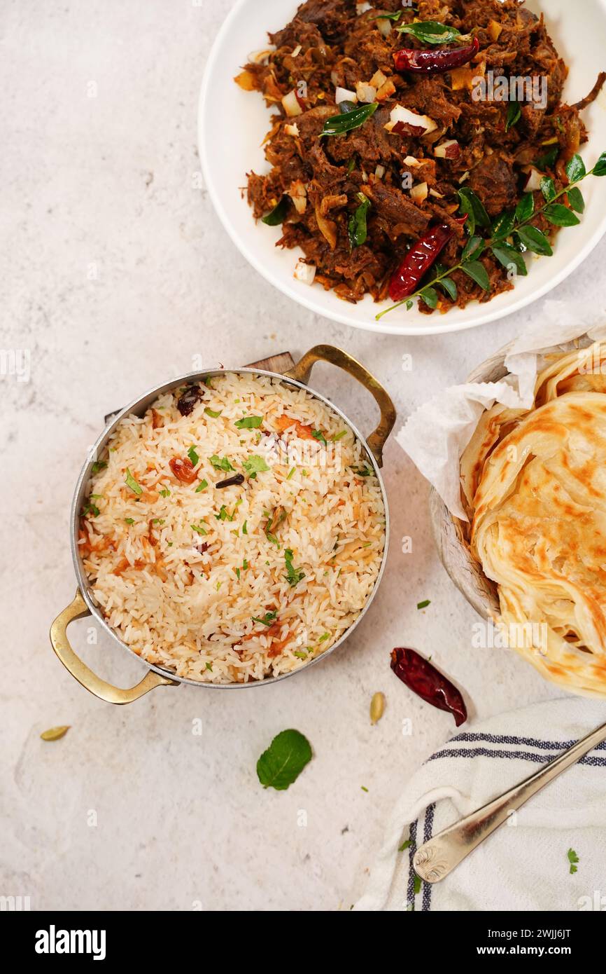 Kerala beef fry roast served with parotta and ghee rice - Malabar Iftar ...