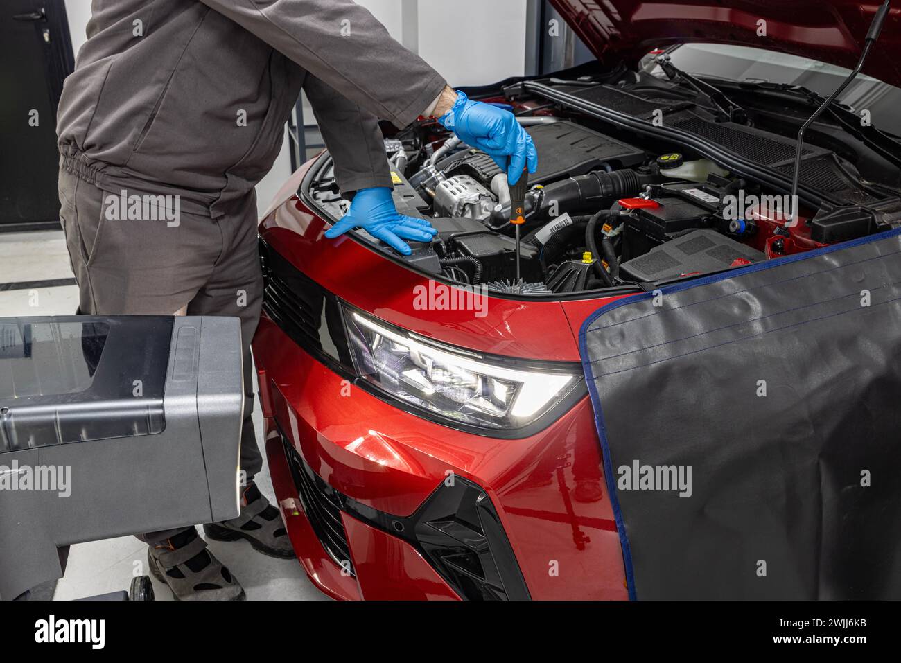 Headlight adjustment of the car in the car service. car repair shop ...