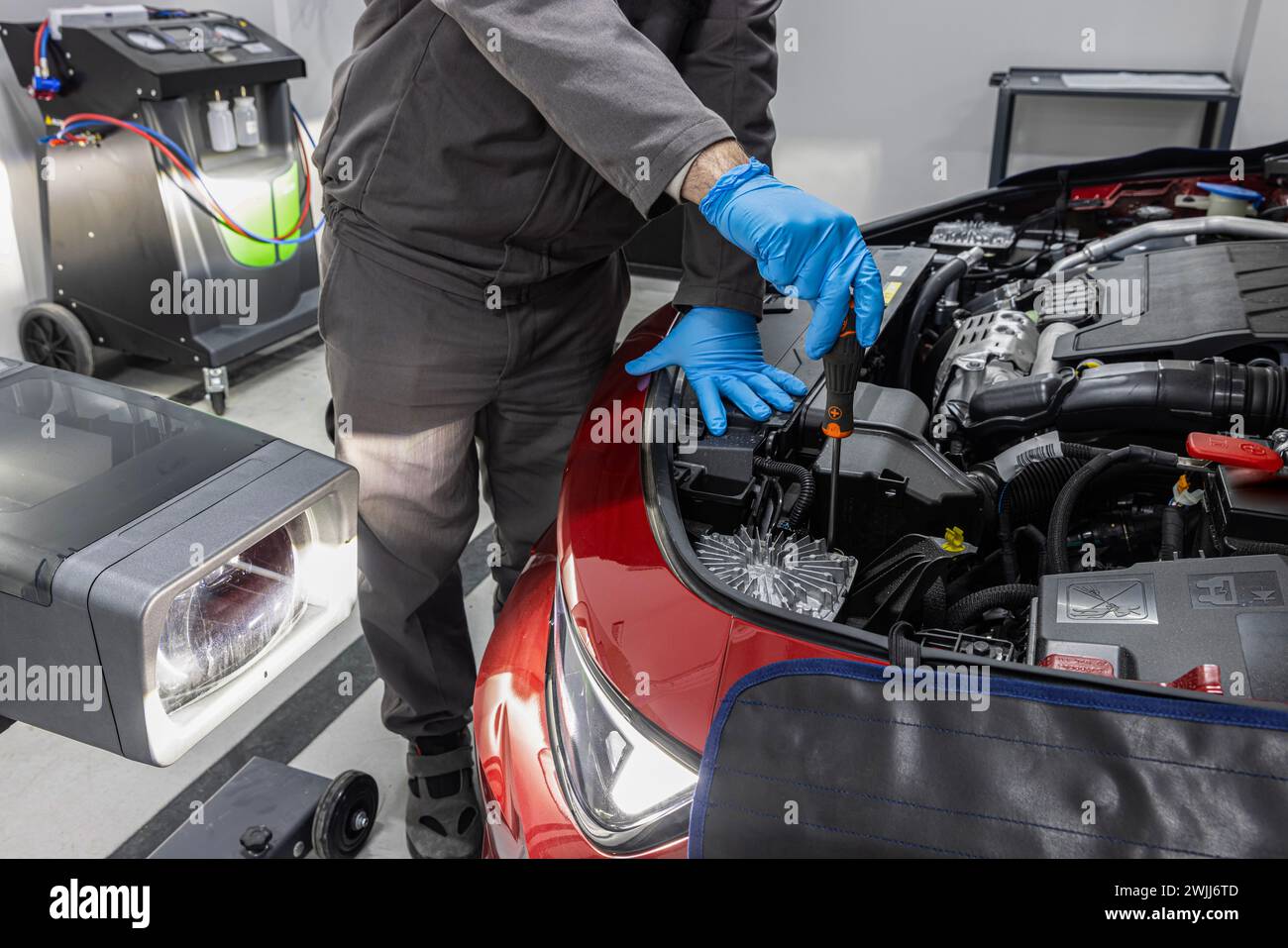 Headlight adjustment of the car in the car service. car repair shop ...