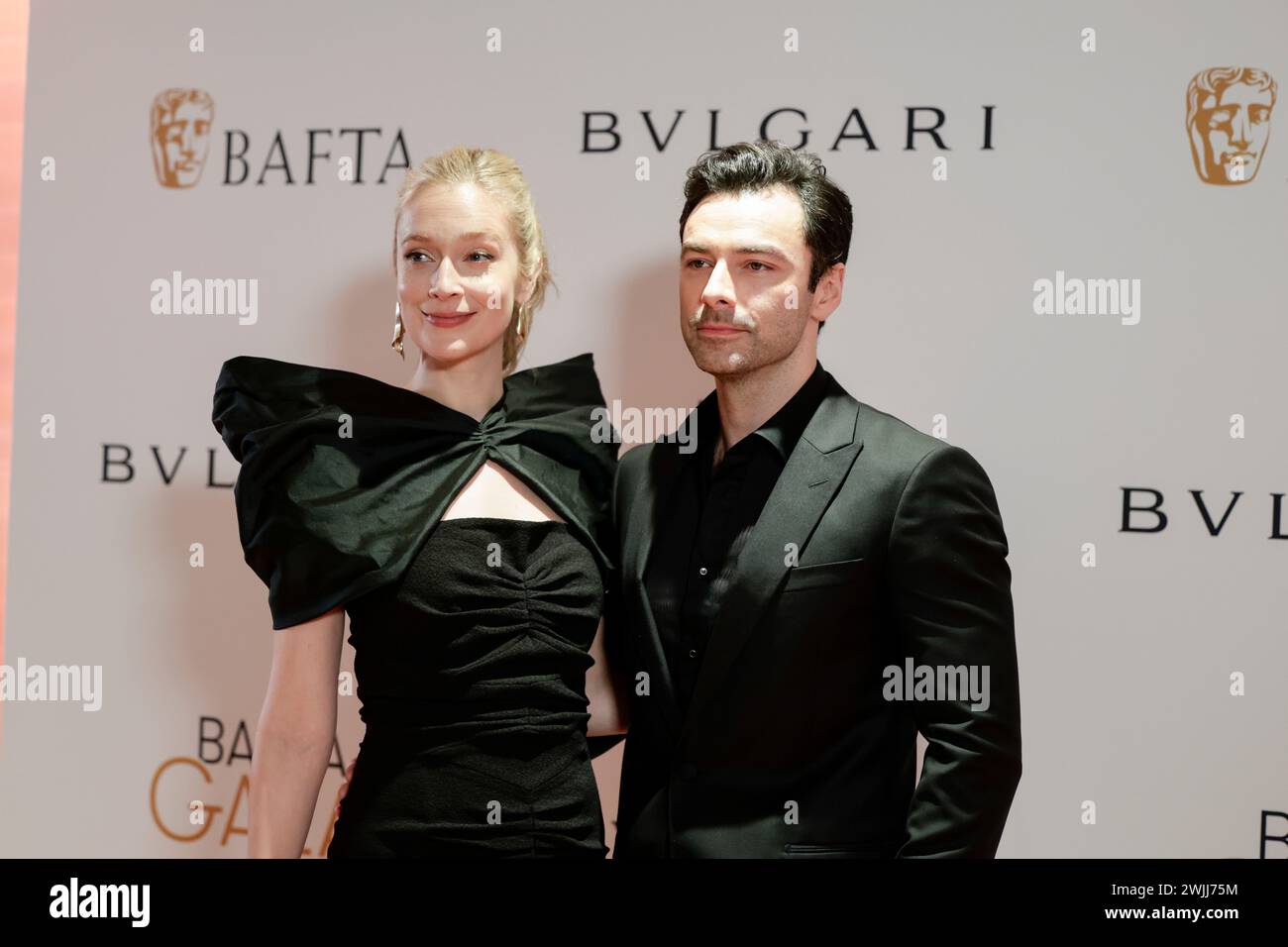 Caitlin Fitzgerald, left, and Aidan Turner pose for photographers upon ...