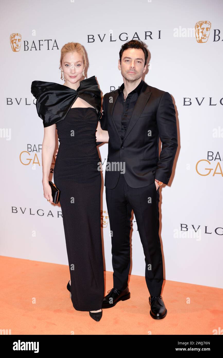 Caitlin Fitzgerald, left, and Aidan Turner pose for photographers upon ...