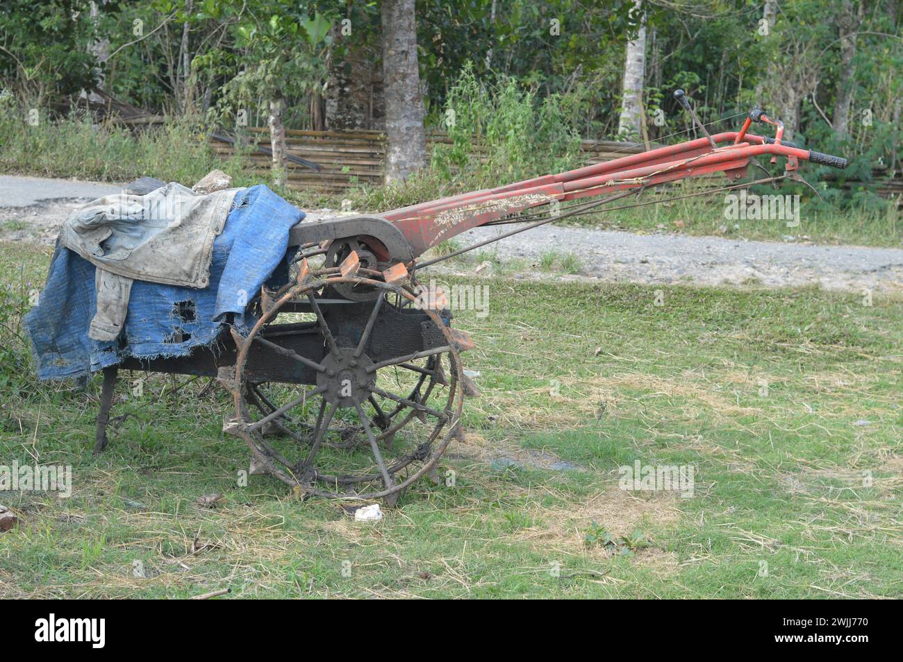 Tractor machine for preparing soil for rice planting Stock Photo - Alamy