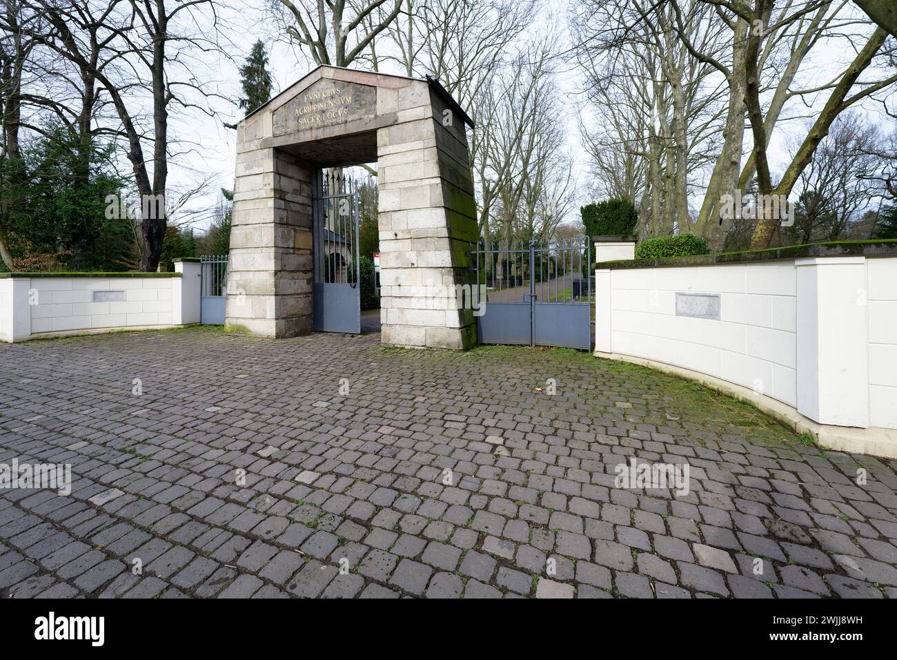 old main entrance with imposing archway of the historic Melaten ...