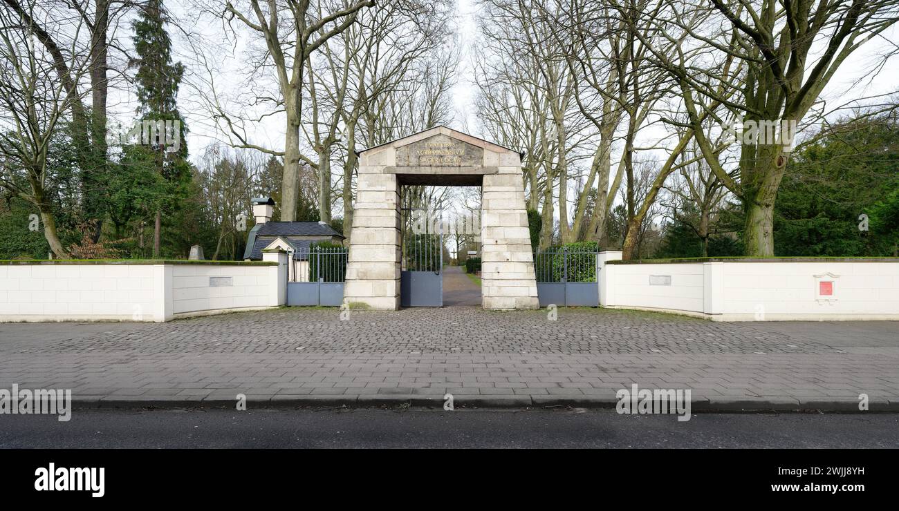 old main entrance with imposing archway of the historic Melaten ...