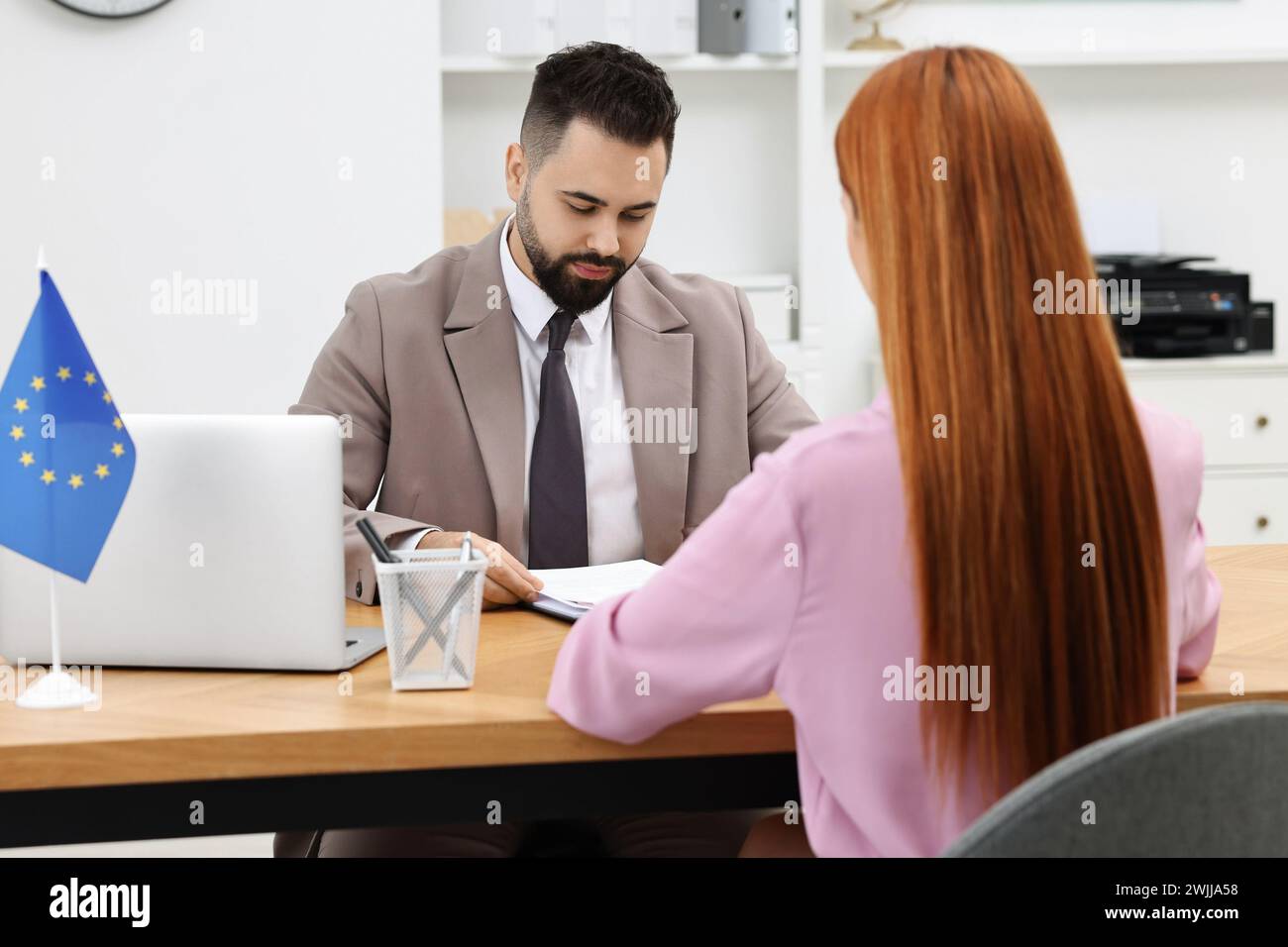 Immigration to European Union. Woman having interview with embassy ...
