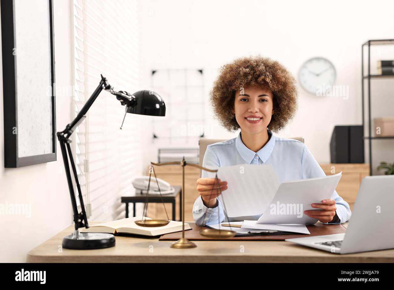 Happy notary working with documents at workplace in office Stock Photo ...