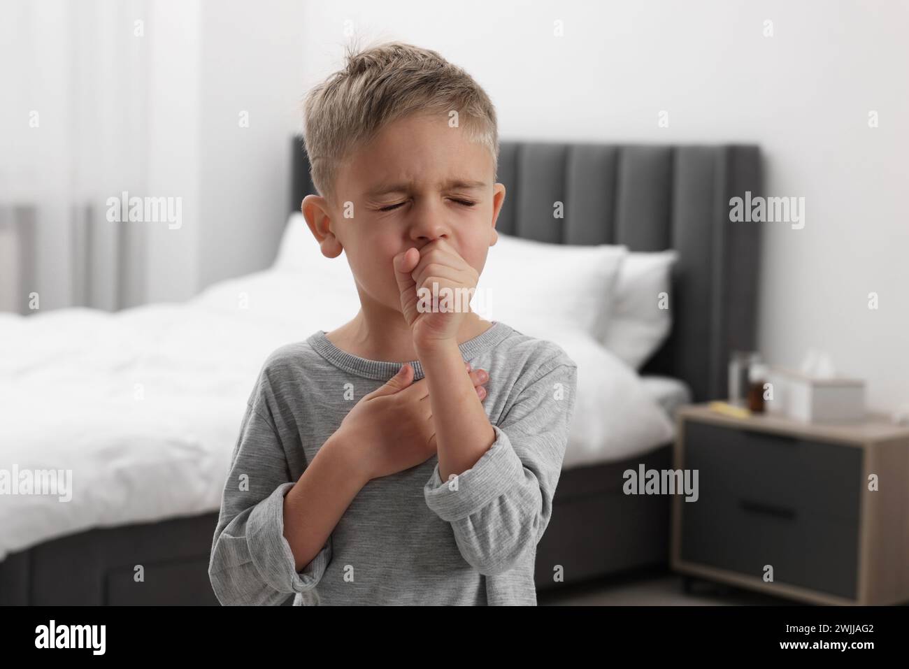 Sick boy coughing at home. Cold symptoms Stock Photo - Alamy