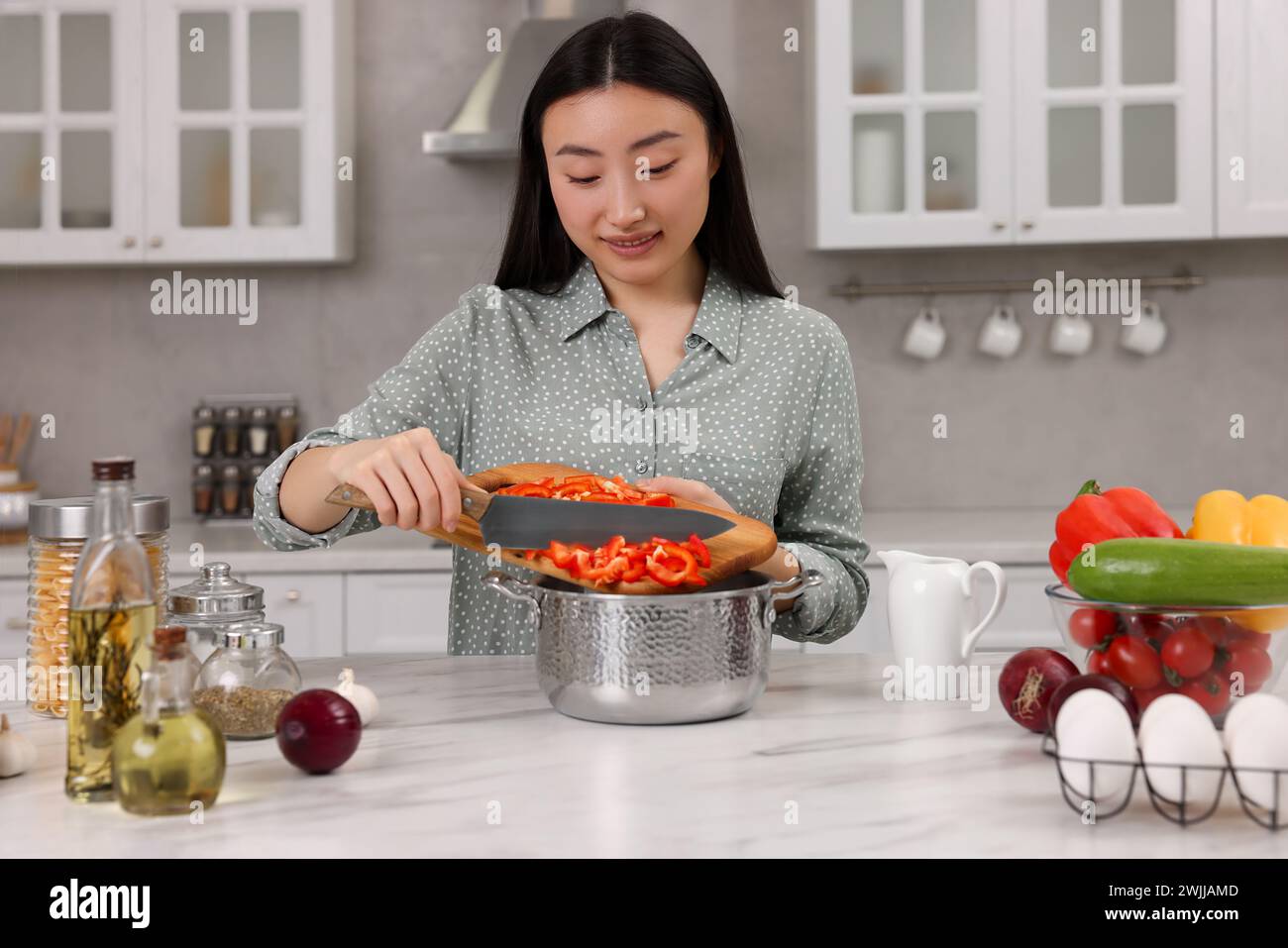 Cooking process beautiful woman hi-res stock photography and images - Alamy