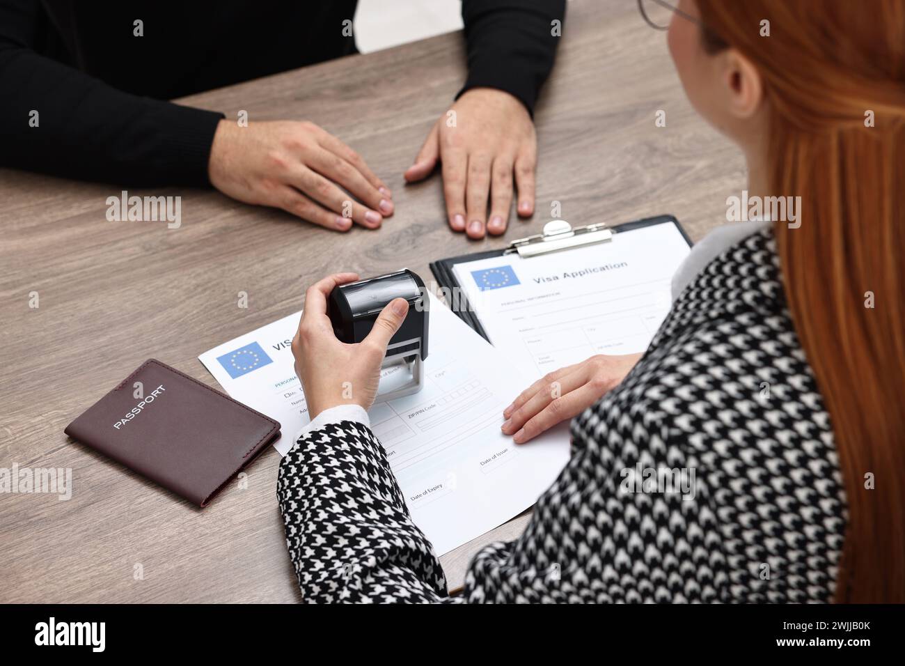 Visa stamp hands hi-res stock photography and images - Alamy