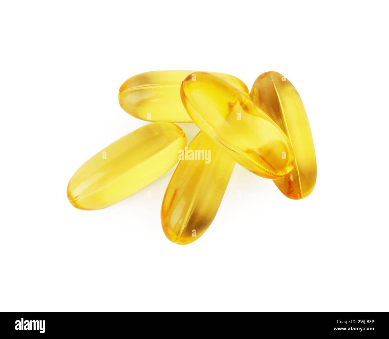 Many yellow vitamin capsules isolated on white, top view Stock Photo ...