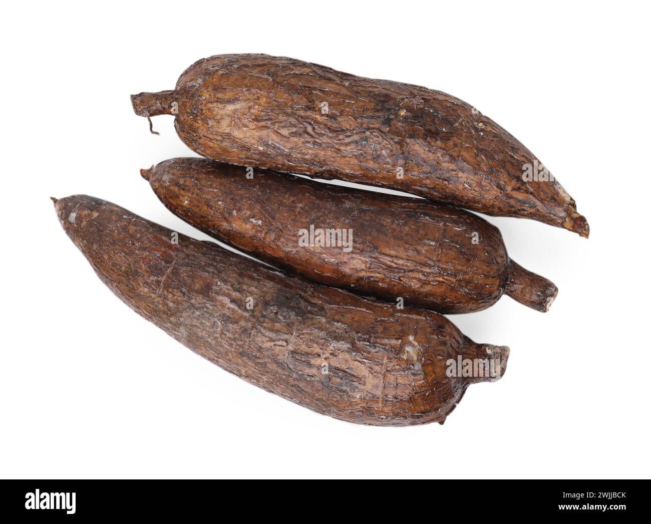 Three whole ripe cassava roots isolated on white, top view Stock Photo ...