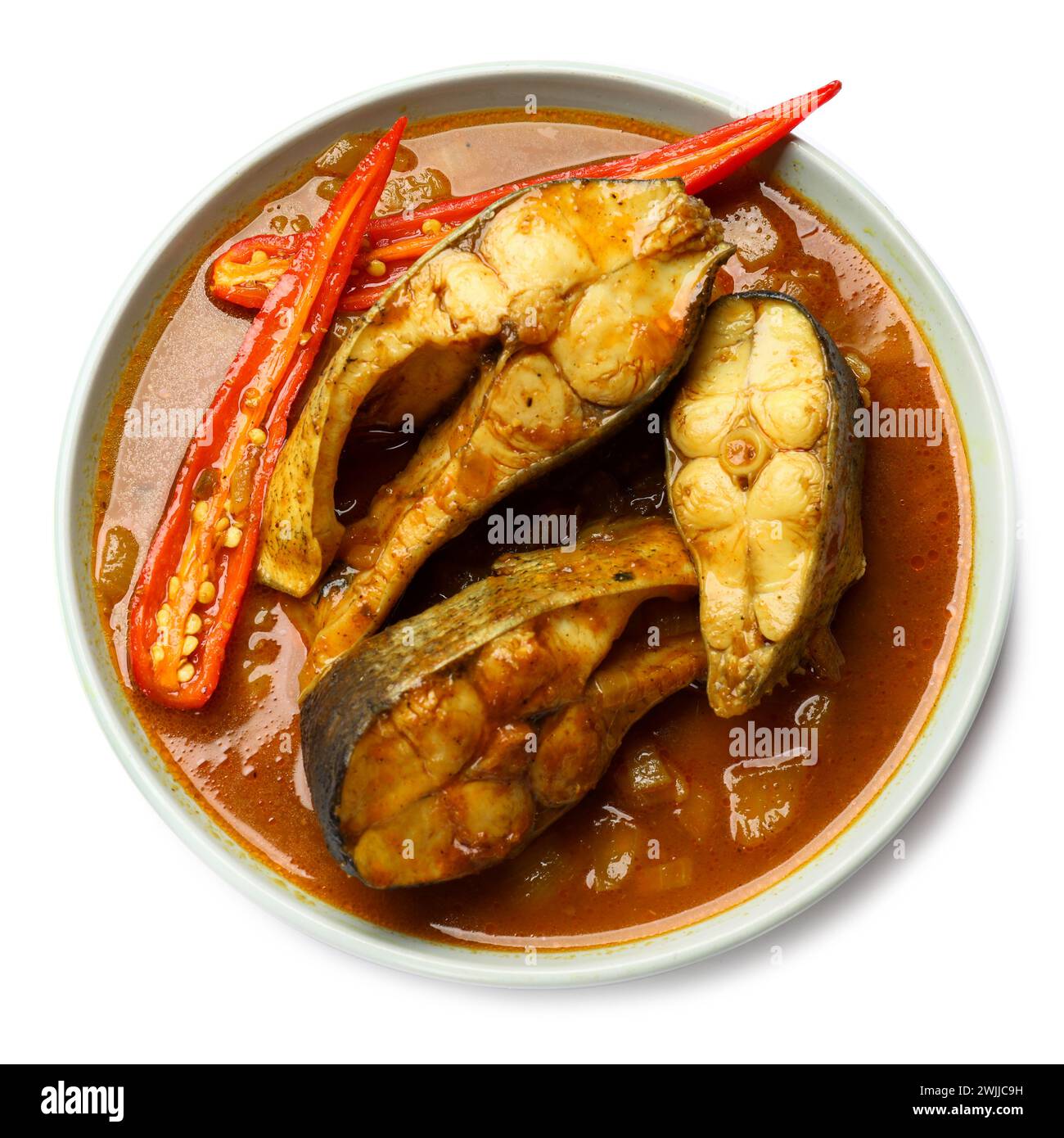 Tasty fish curry on white background, top view Stock Photo - Alamy