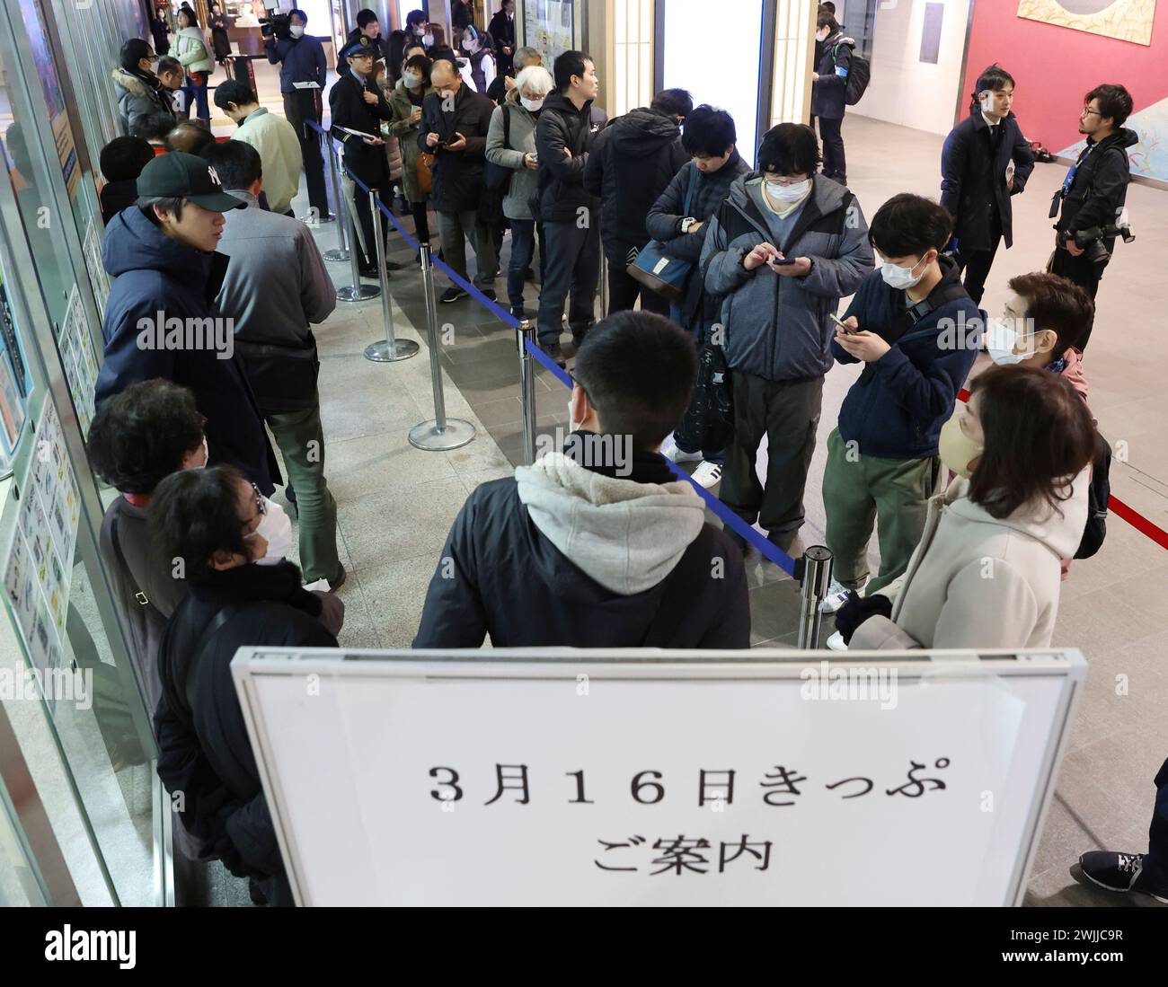 People line up at a ticket office called Green Window to buy Hokuriku ...