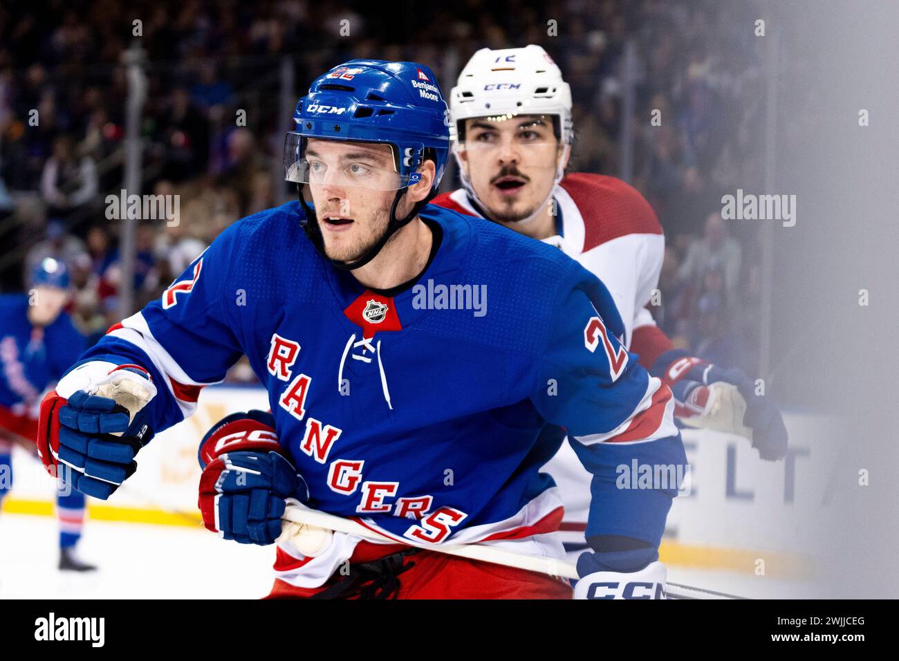 New York Rangers center Jonny Brodzinski, front, is held by Montreal ...