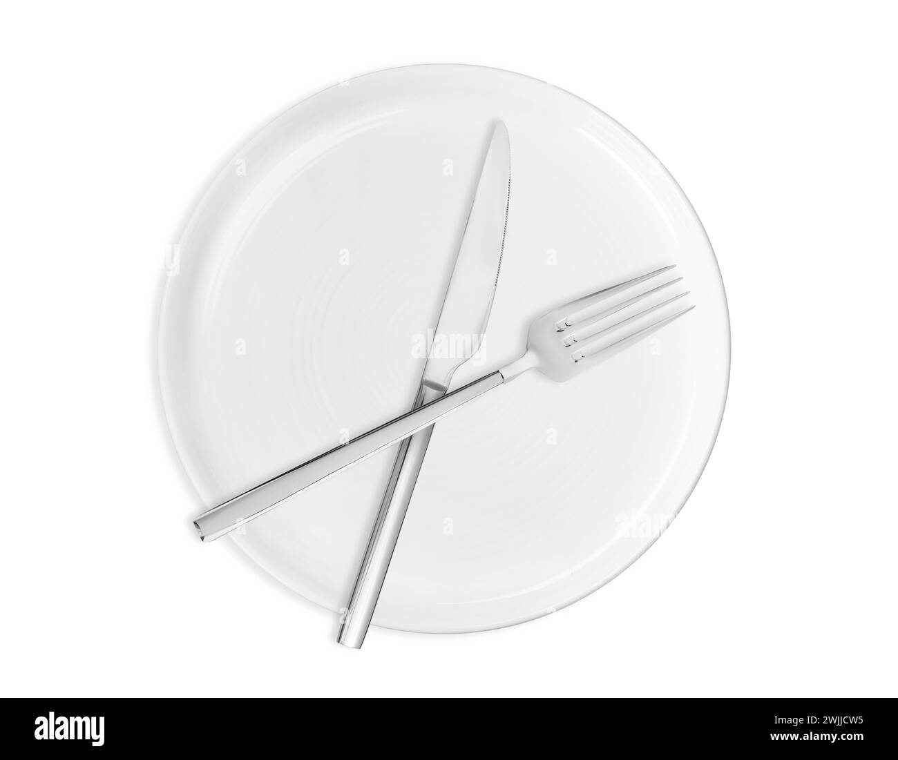 Clean plate, fork and knife on white background, top view Stock Photo ...